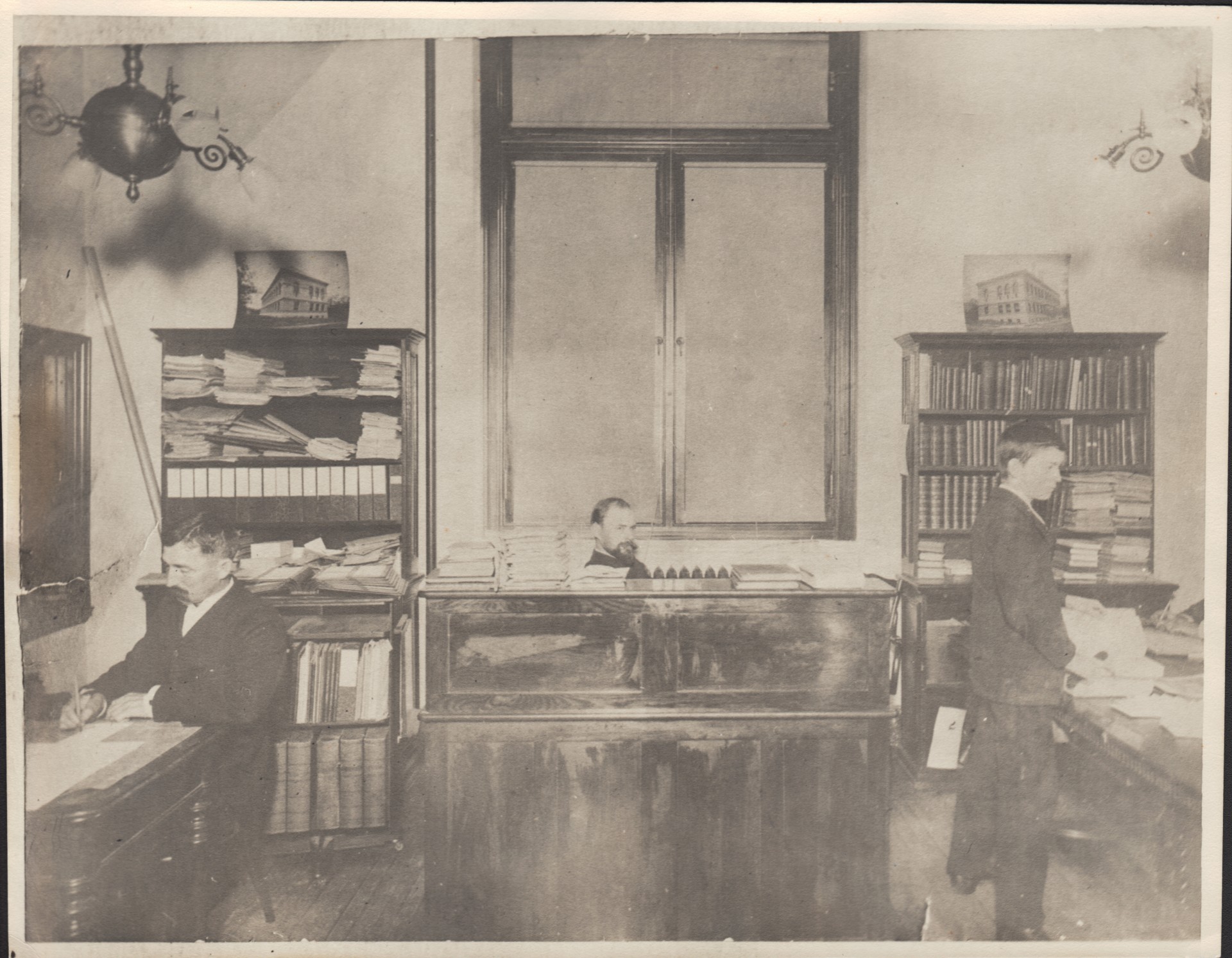 Library employees at work in Stark Street Library office | The Gallery